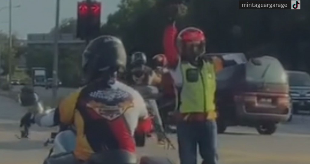 Two held for allegedly stopping traffic to allow bike convoy to pass ...